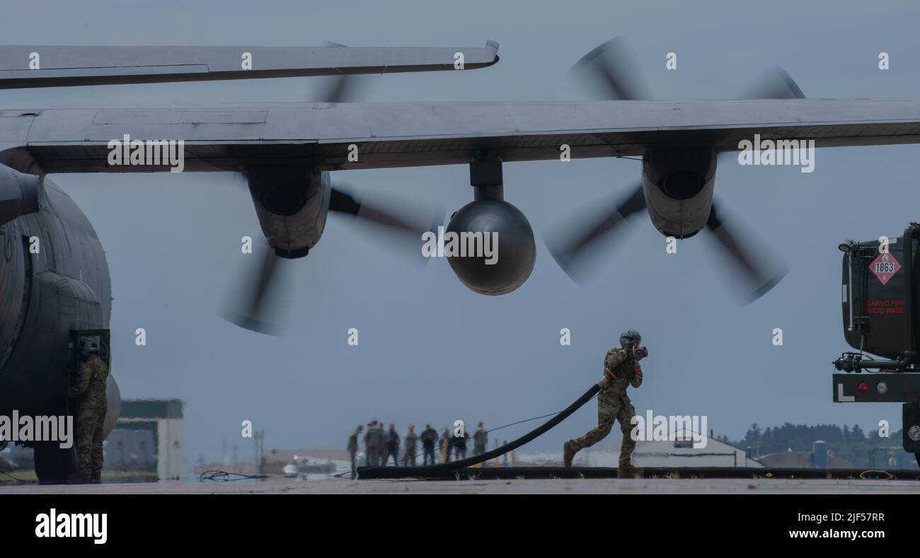 A crew chief from the 182nd Airlift Wing conducts a wet-wing defuel on ...