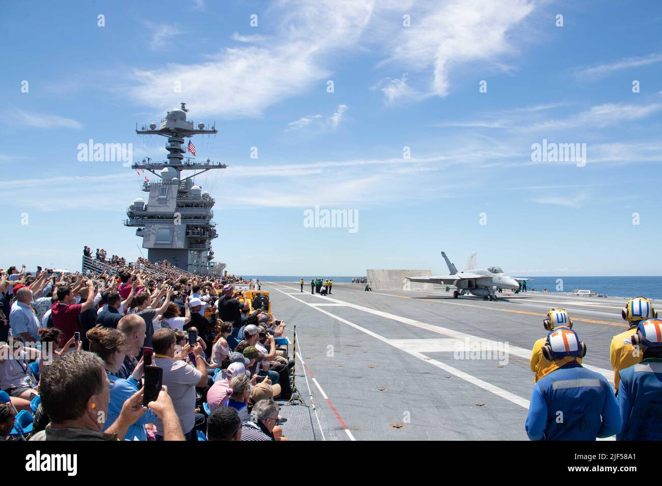 Sailors and their families and friends observe the USS Gerald R. Ford’s ...