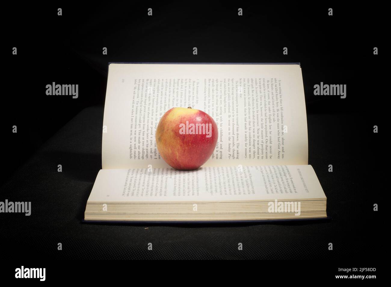 Apple and book Stock Photo - Alamy