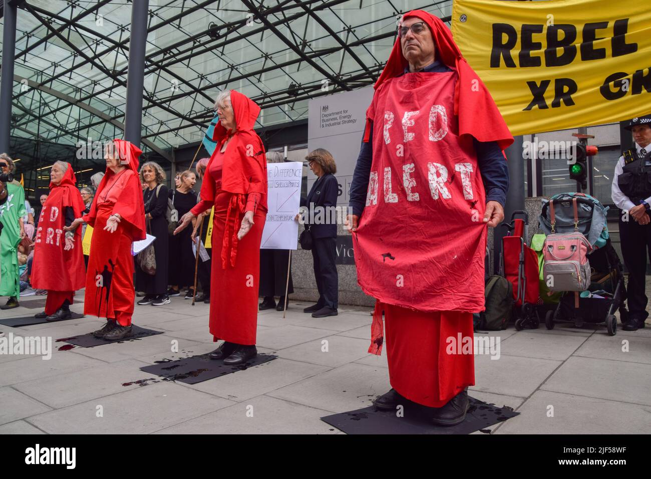London, UK. 29th June, 2022. Activists wear 'Red Alert' costumes ...