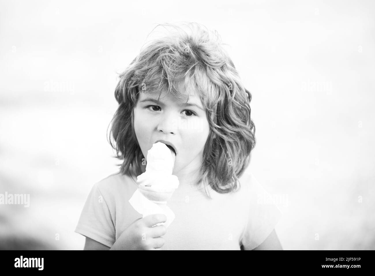 Caucasian child eating ice cream, portrait close up. Kids face Stock ...