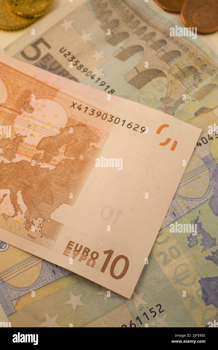 Euro paper currency bank notes and coins Stock Photo - Alamy