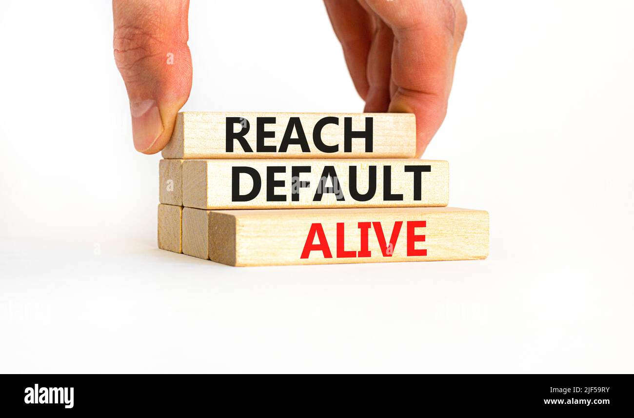 Reach default alive symbol. Concept words Reach default alive on wooden ...