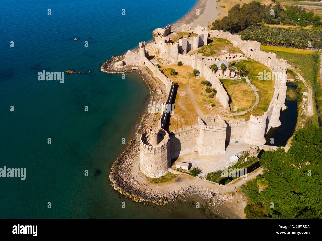Aerial view of ancient Mamure Castle on Mediterranean coast, Turkey ...