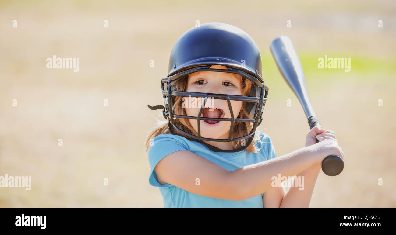Kid baseball ready to bat. Child batter about to hit a pitch during a ...