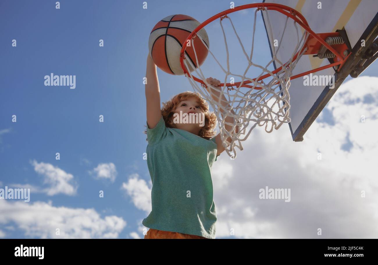 Active kids enjoying outdoor game with basketball, outdoor on ...