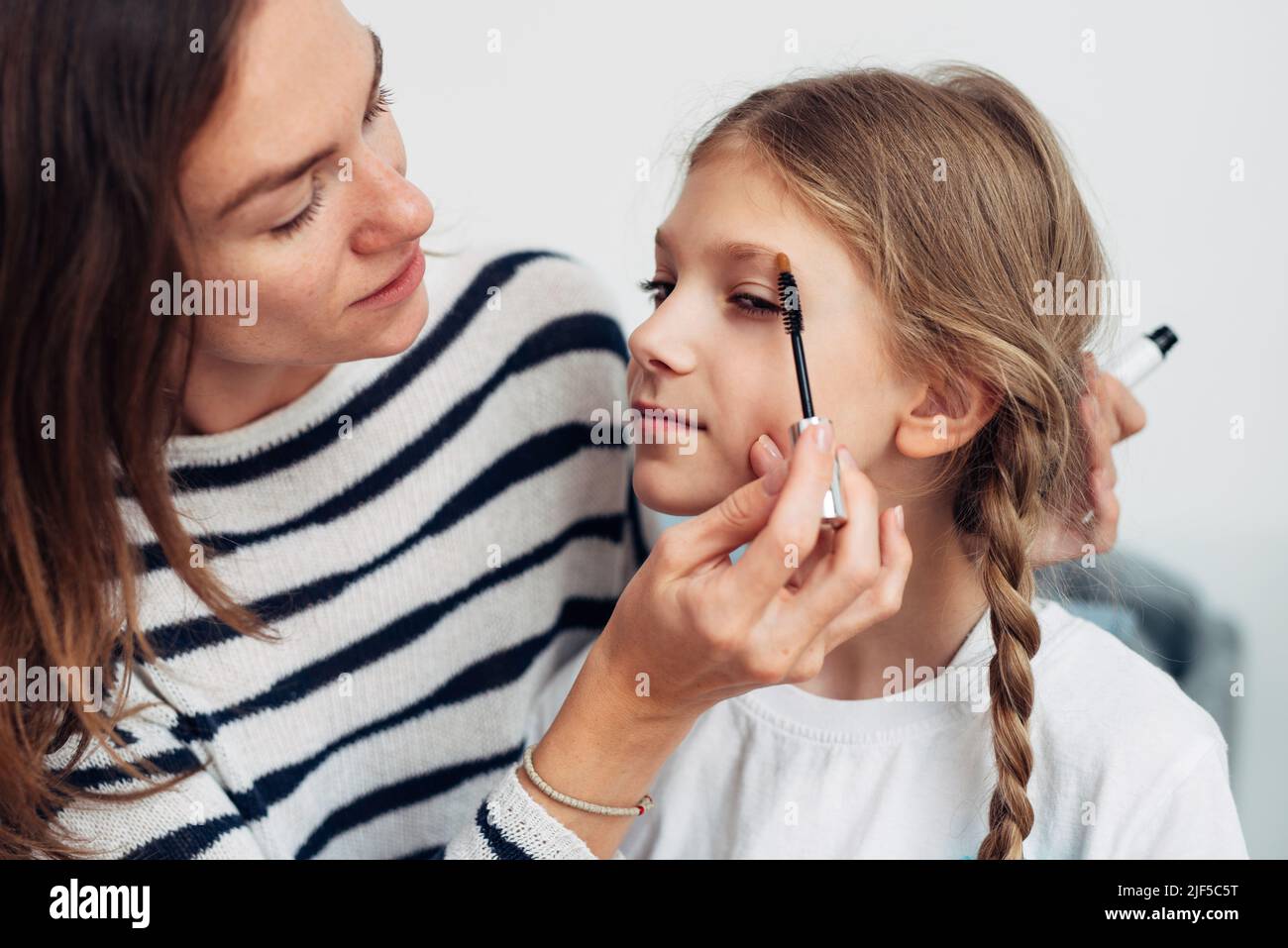 Mother and daughter do their own makeup Stock Photo - Alamy