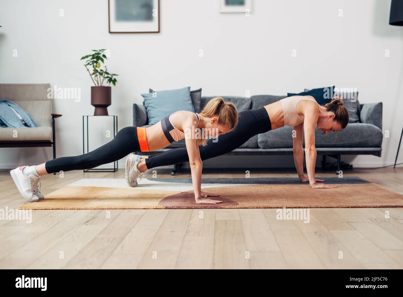 Work out at home, do push-ups or plank exercises on straight arms Stock ...