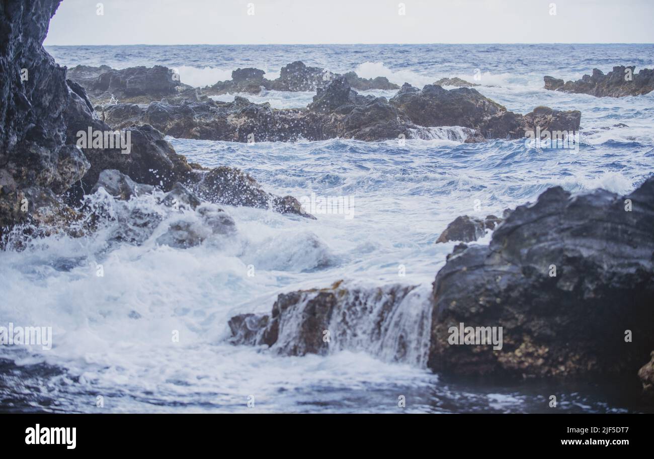 Splashing waves on the rock in the sea. Wave hit the stone in the ocean ...
