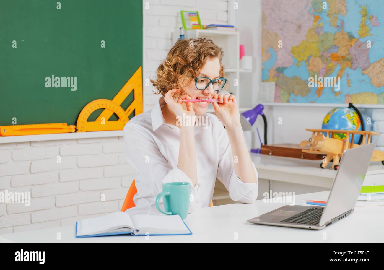 Back to school. Female teacher with laptop. Online education, knowledge ...