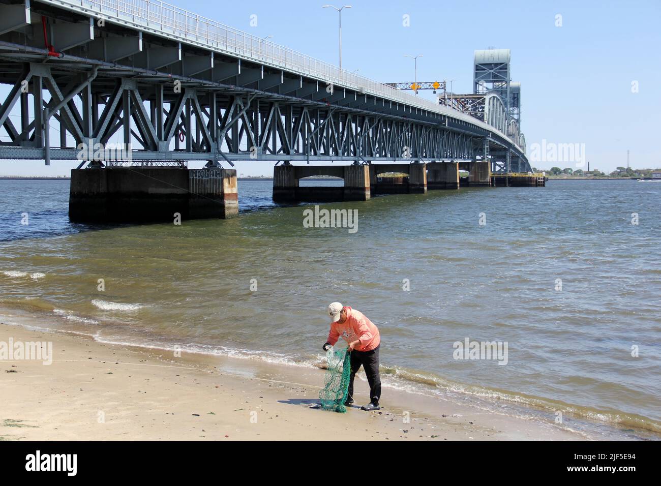 Marine ParkwayGil Hodges Memorial Bridge, fisherman with a net on ...