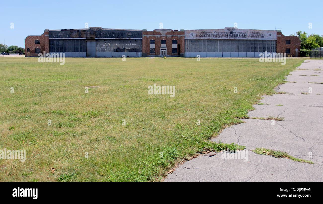 Floyd Bennett Field, grass covered airfield, abandoned hangar with Art ...