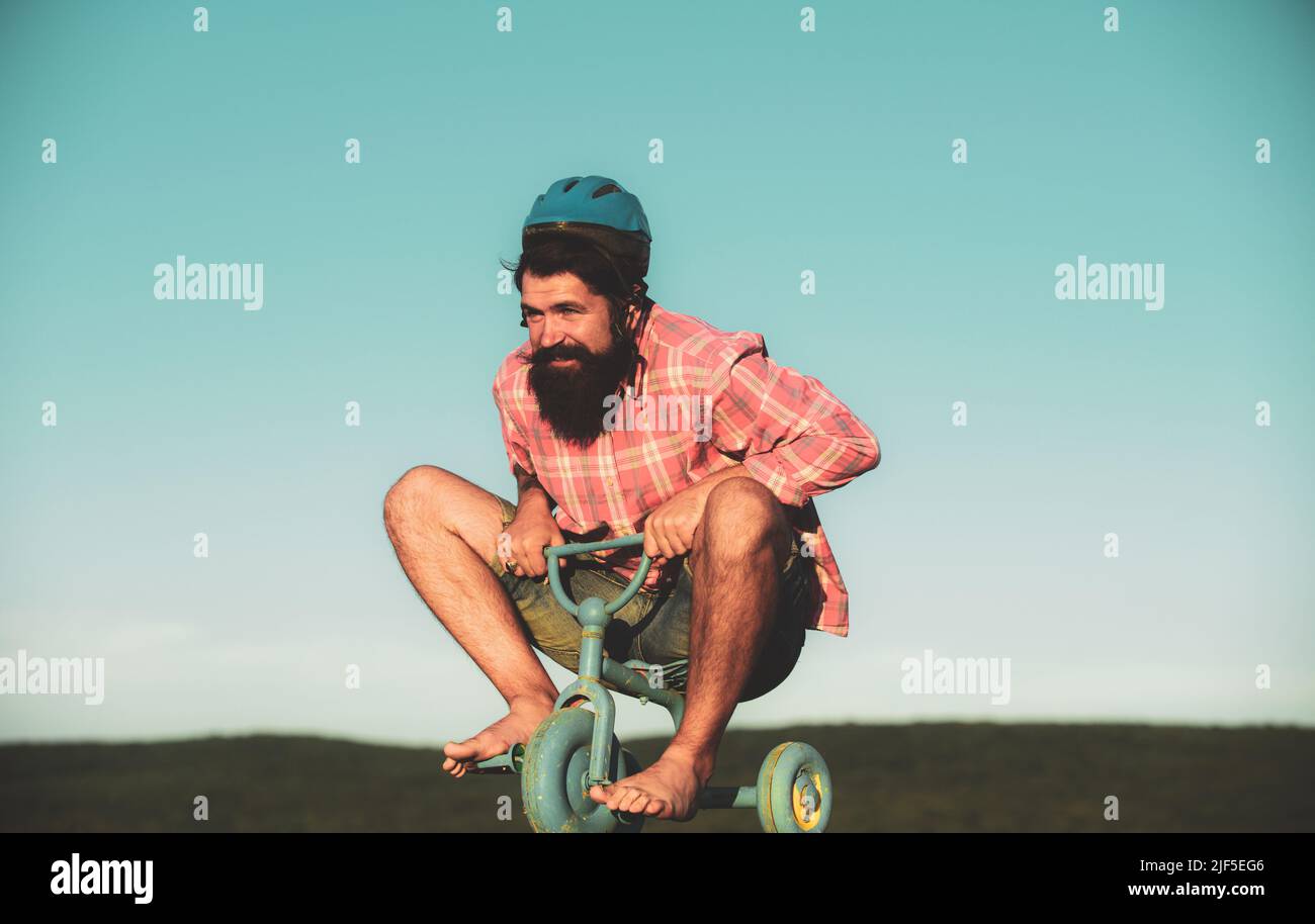 Funny crazy man is riding a bike Stock Photo - Alamy