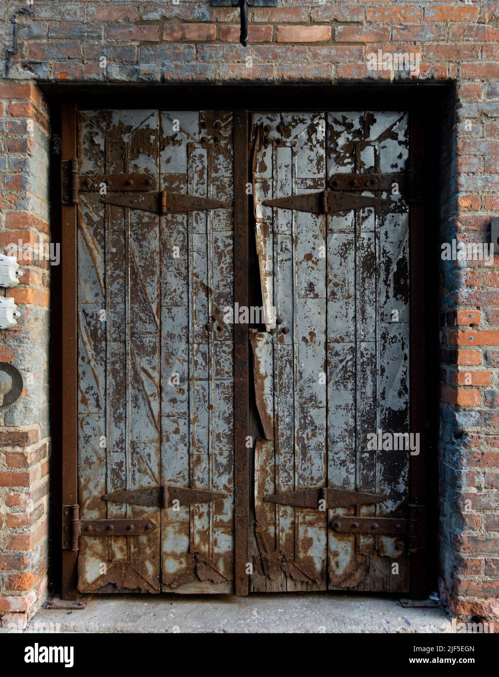 Old weathered metal double doors with heavy rust and peeling paint set ...