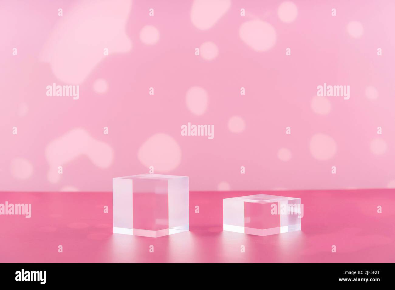 Acrylic blocks on pink background, pedestal cosmetic display glass ...
