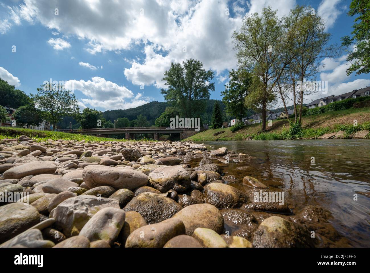 Kordel, Germany. 23rd June, 2022. Tons of pebbles lie along the Kyll ...