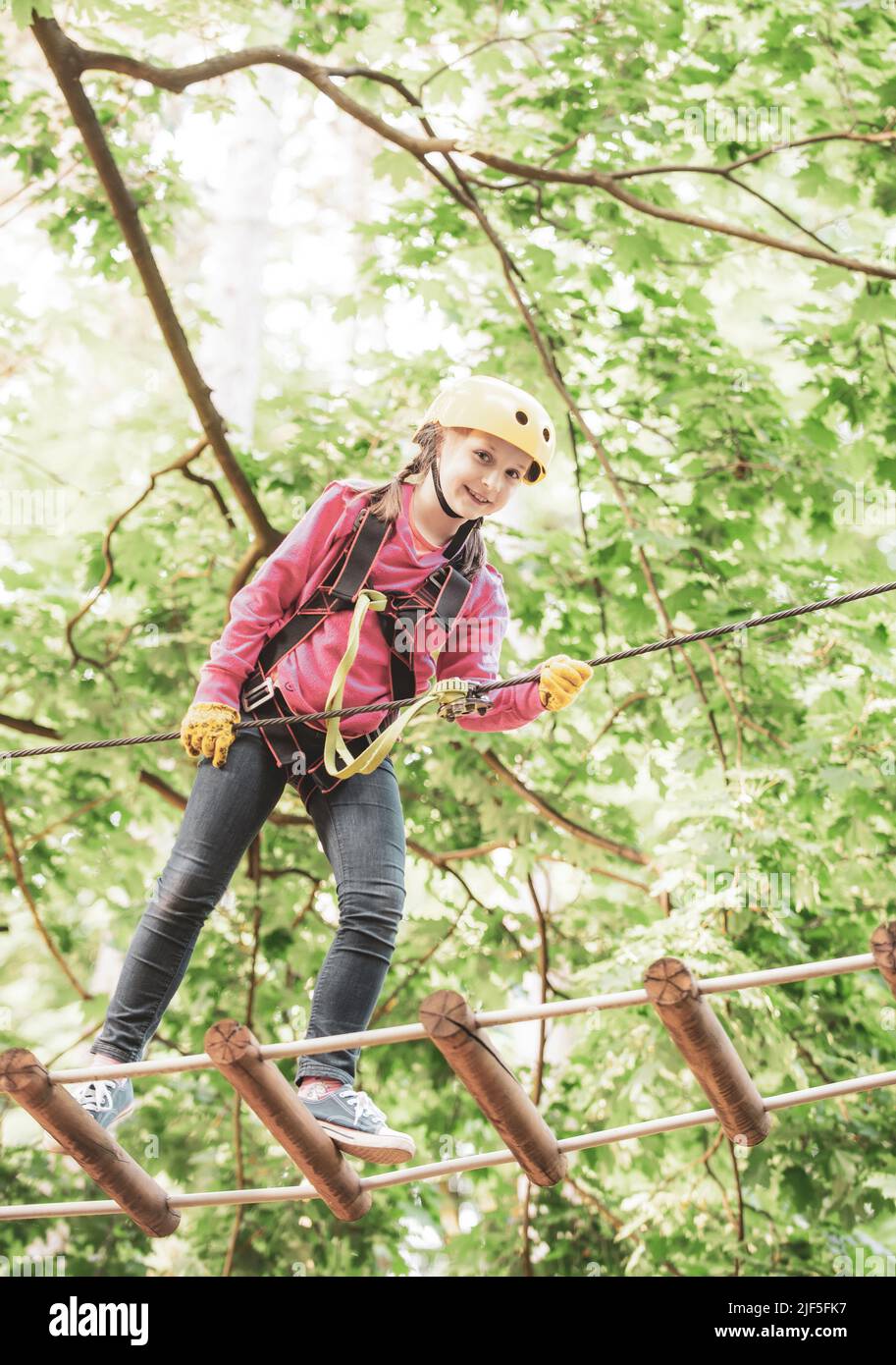 High ropes walk. Helmet - safety equipment for Child playing. Little ...