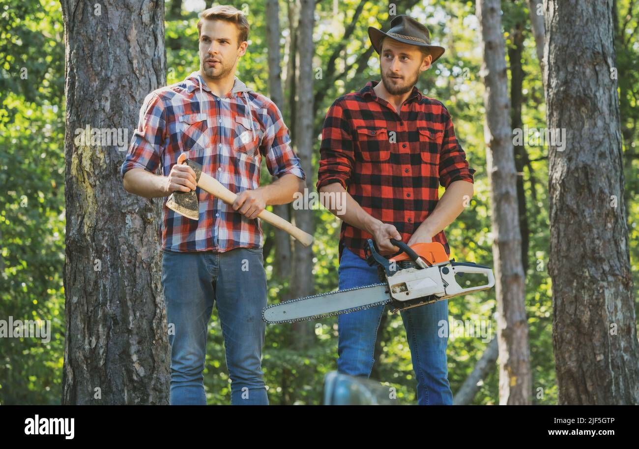 Man woodcutter holding ax. Axe in lumberjack hands cutting wood ...
