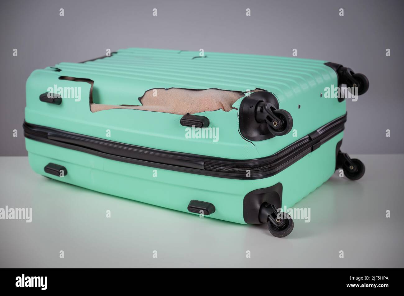Damaged suitcase hi-res stock photography and images - Alamy