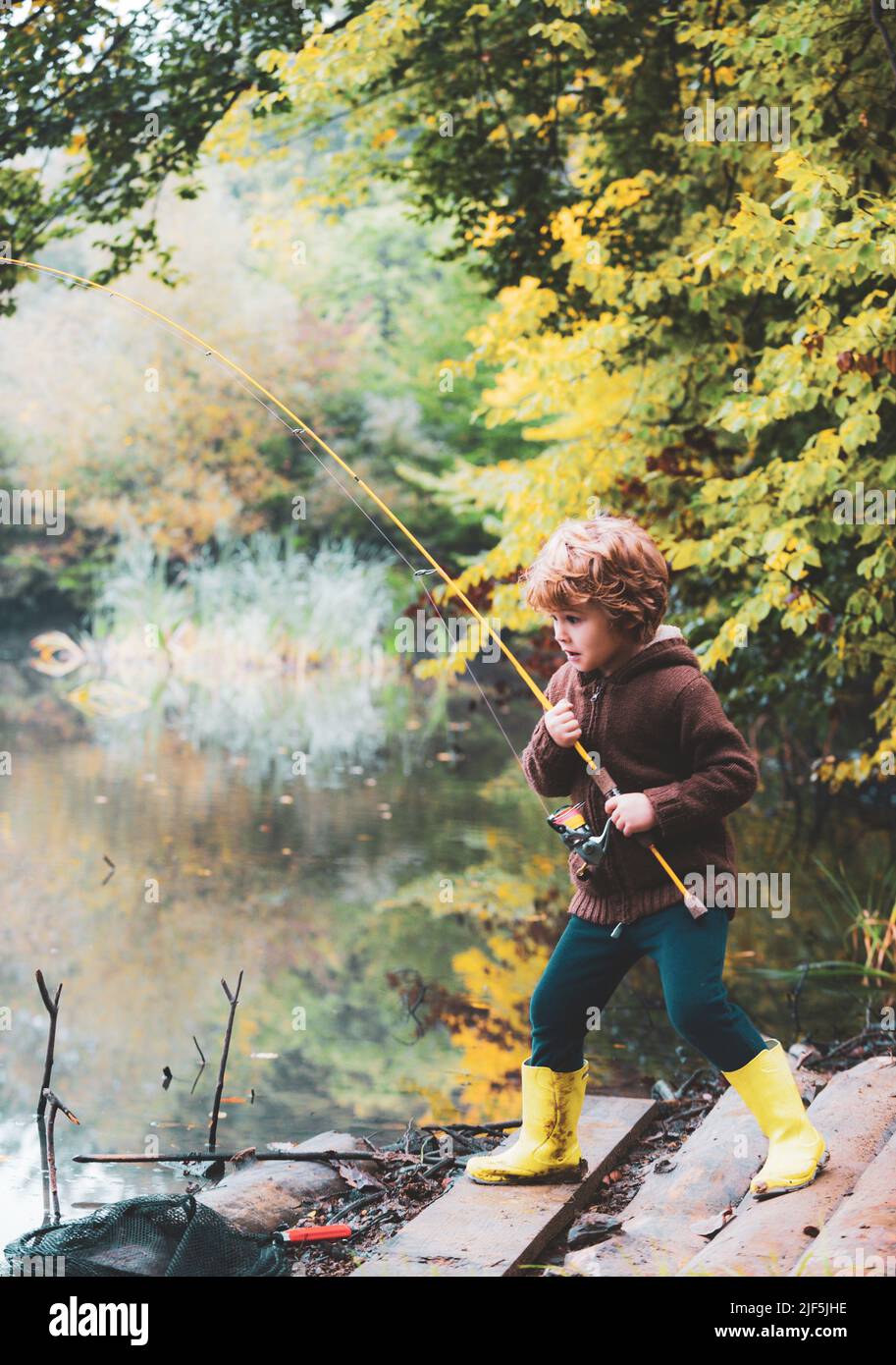 Little boy fishing. Kid pulling rod while fishing on weekend Stock ...