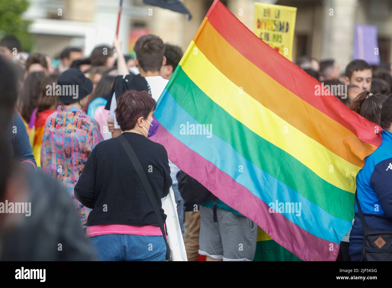 Coruna-Spain.Demonstrator carrying the flag with the LGBT colors during ...