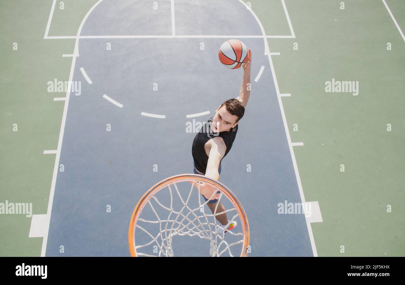 Caucasian basketball player of team in action, motion in jump. Concept ...