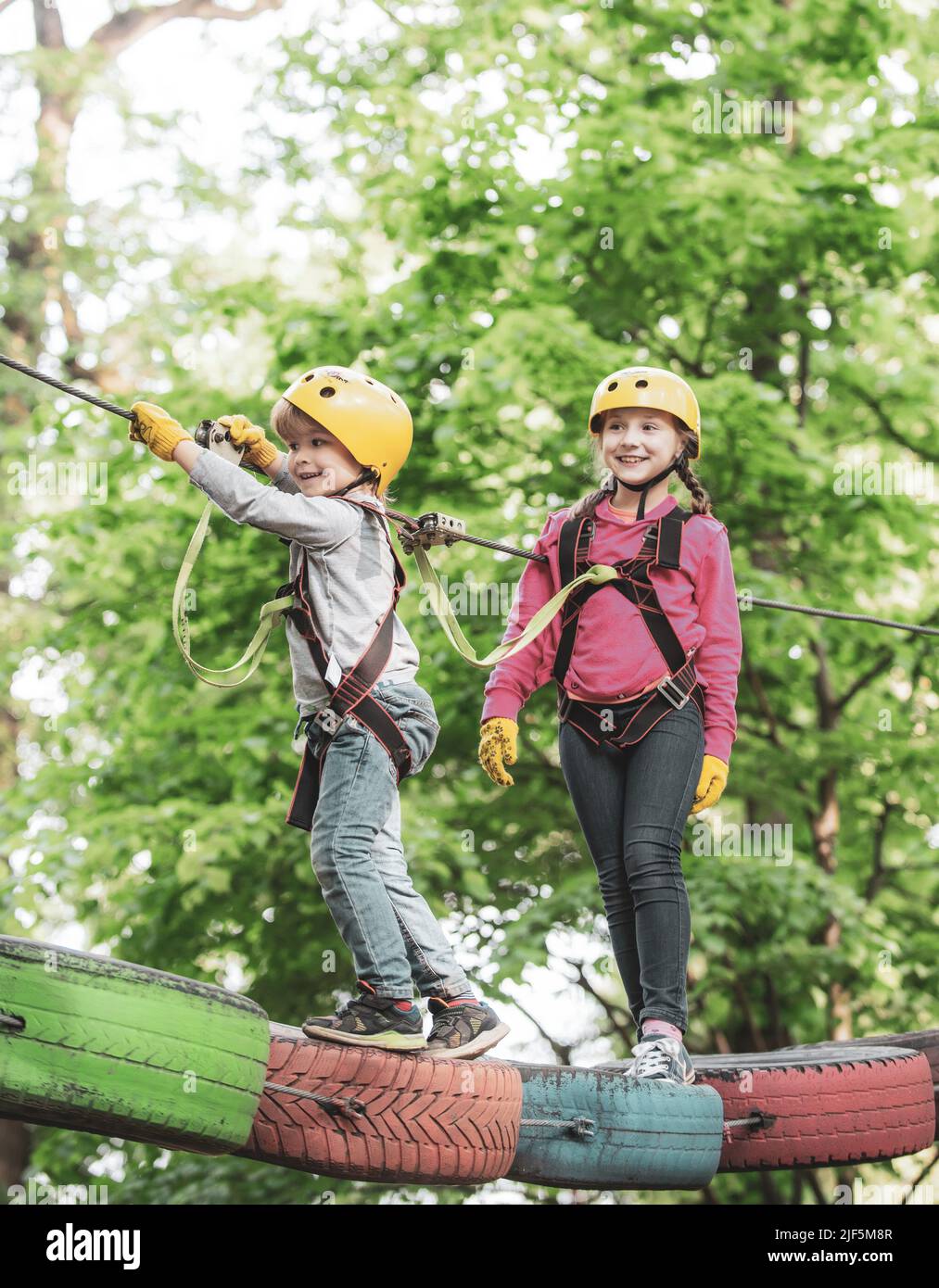 Small boy enjoy childhood years. Happy child boy calling while climbing ...