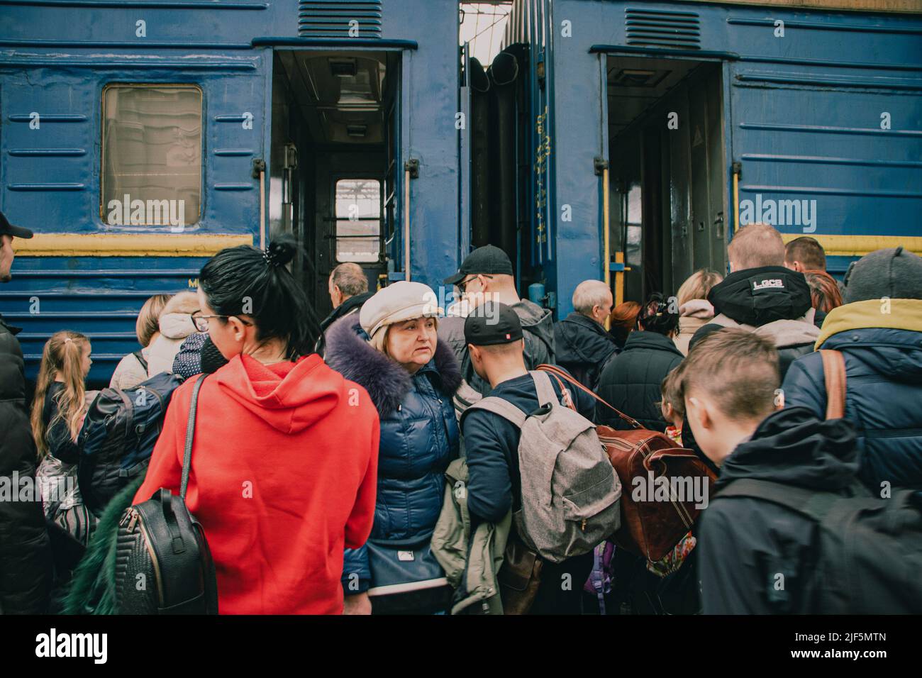 Ukrainian entering the train at the train station. The train station in ...