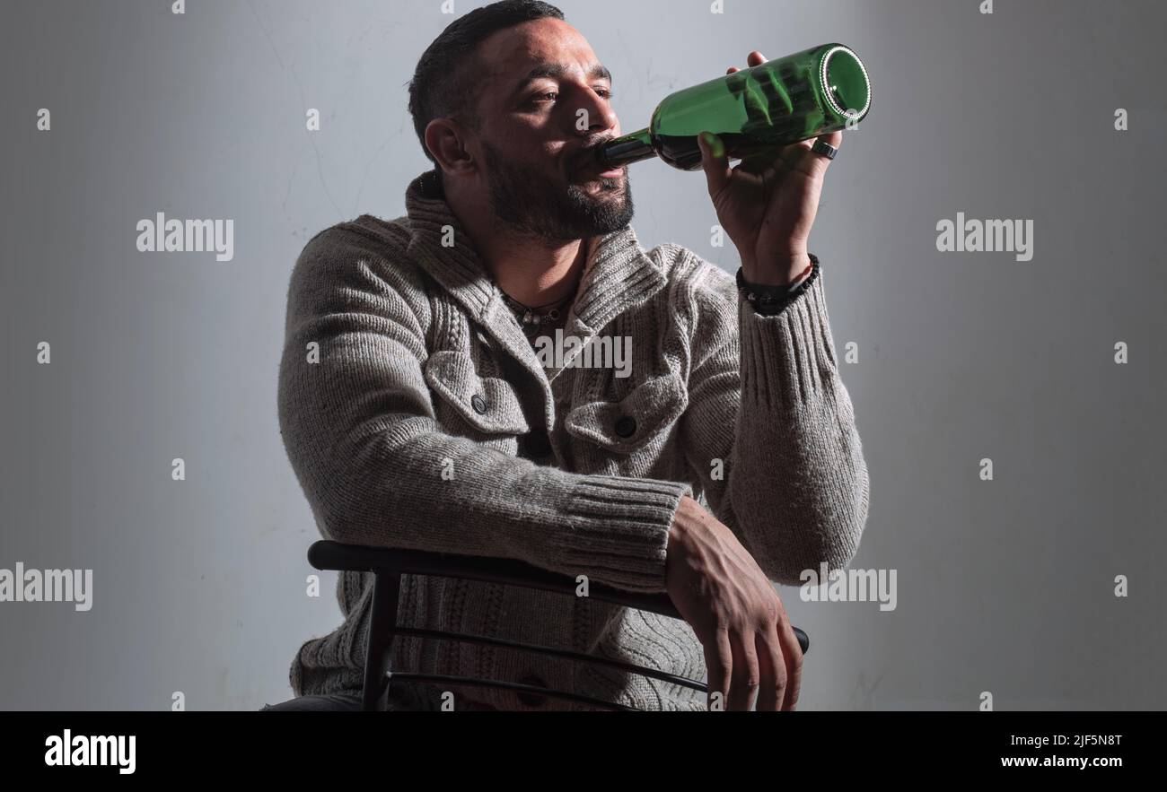 alcoholism, alcohol addiction and people concept. male alcoholic with ...