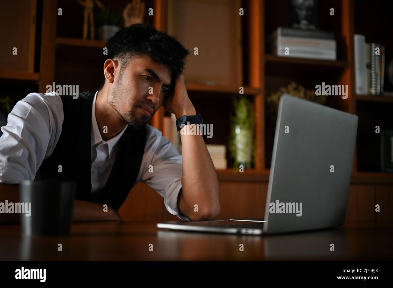 Asian businessman bored desk hi-res stock photography and images - Alamy
