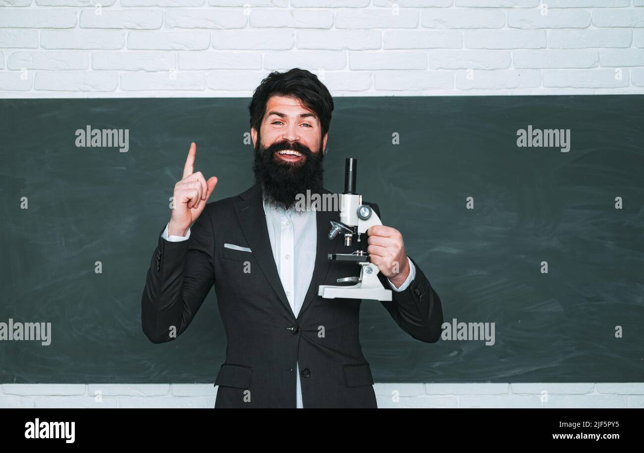 Student preparing for test or exam. Professor in class on blackboard ...