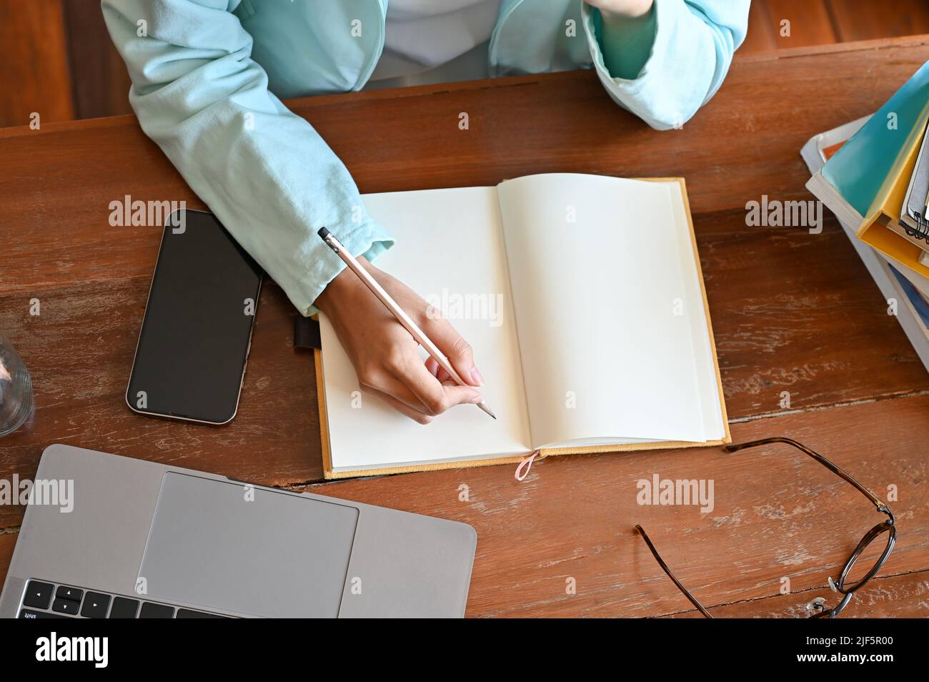 Overhead shot of a young female high school student or college student ...