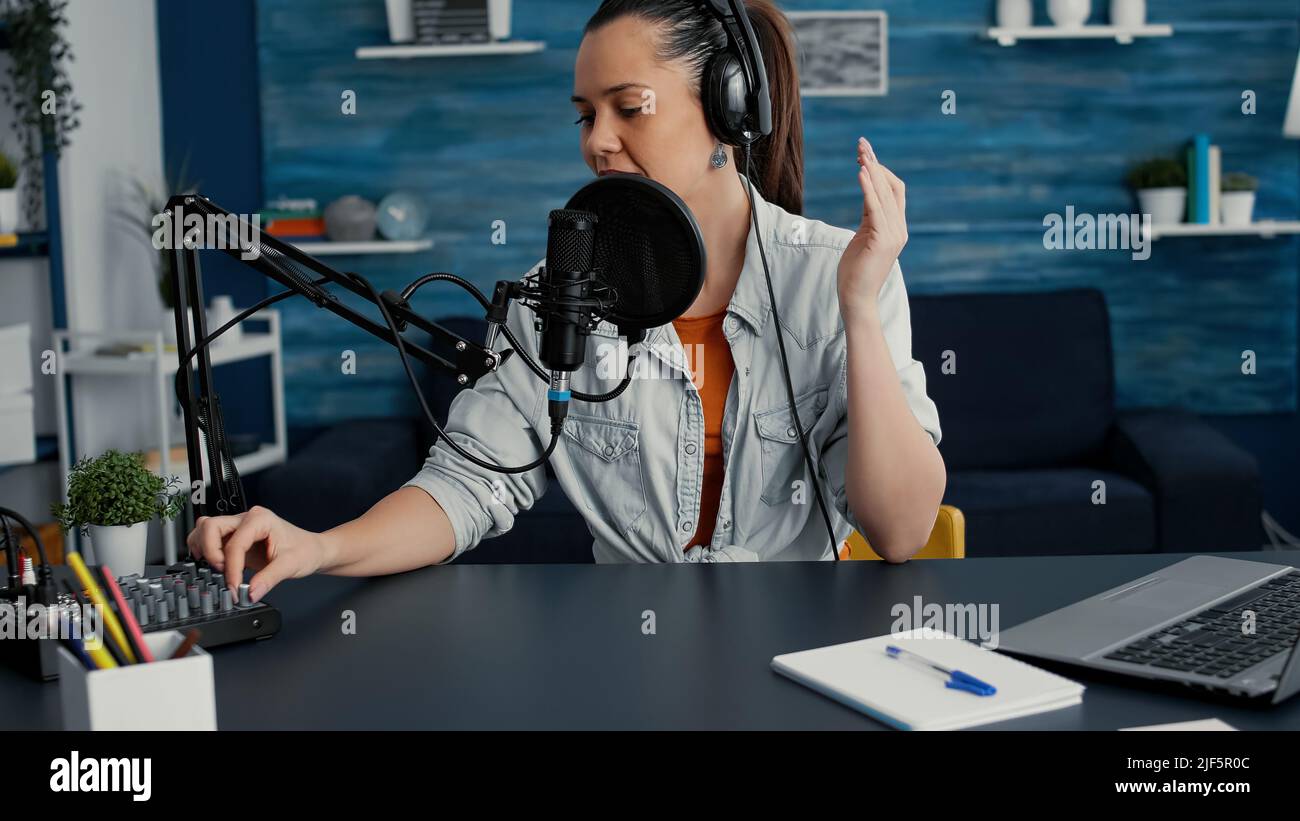 Popular internet streaming influencer putting headphones on and ...