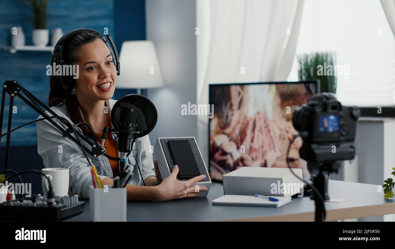 Famous social media star doing unboxing video of modern smartphone ...