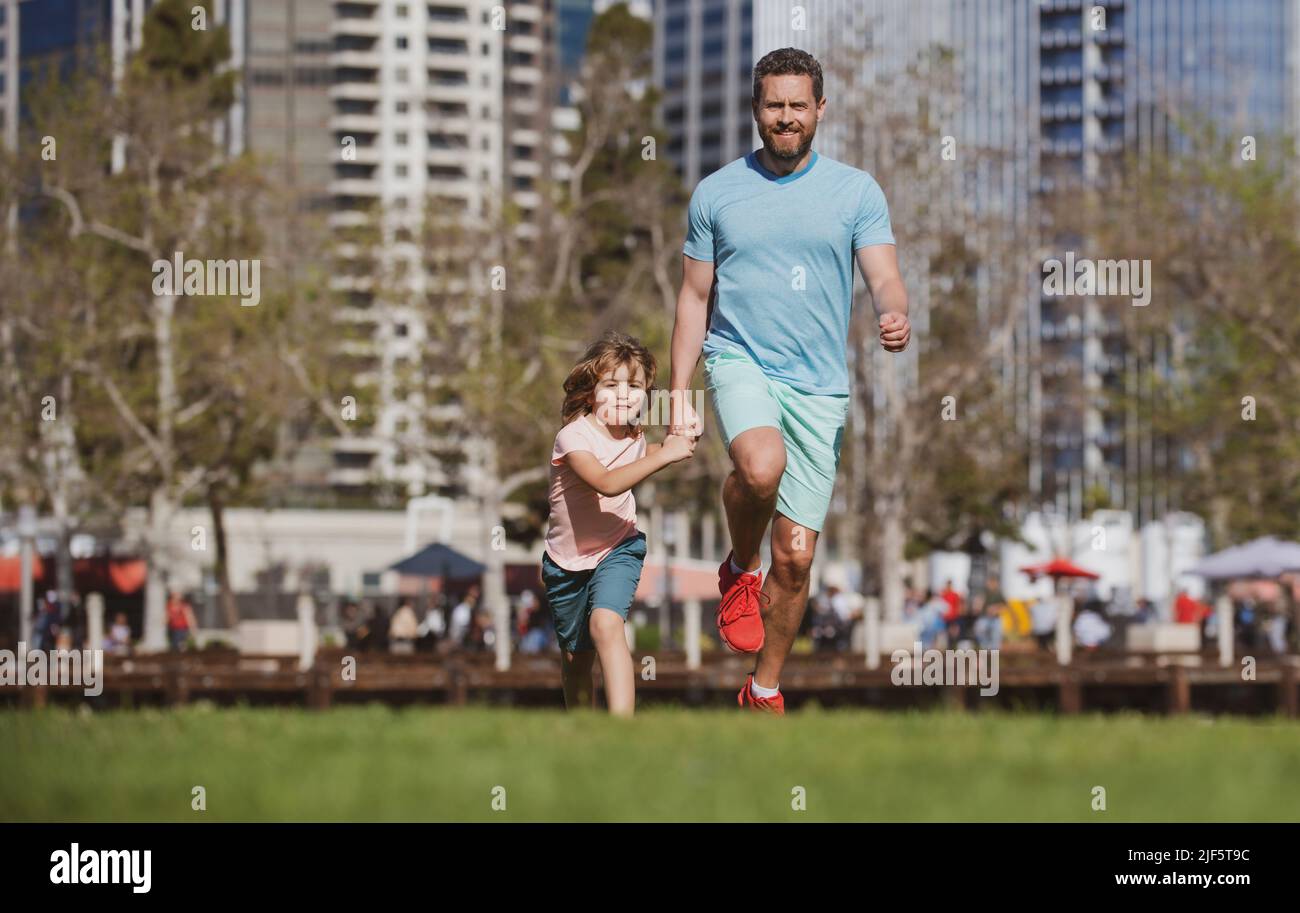 Father and son running in city background. Urban families Stock Photo ...