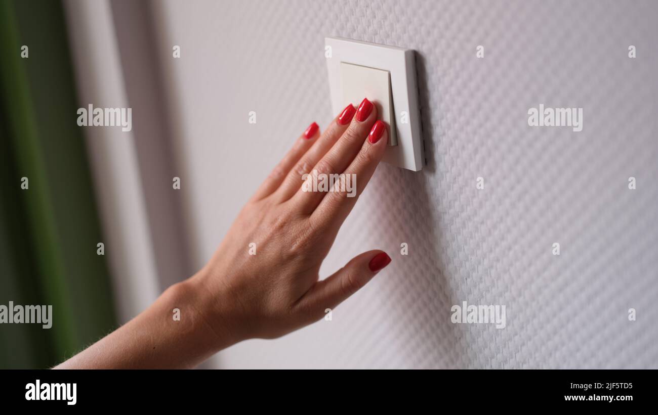 Woman turn off light home hi-res stock photography and images - Alamy