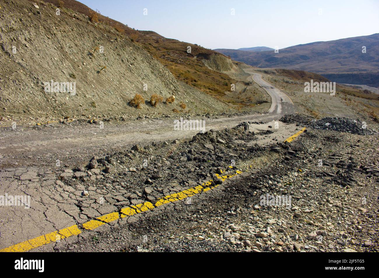 Collapsing asphalt road in the mountains Stock Photo - Alamy