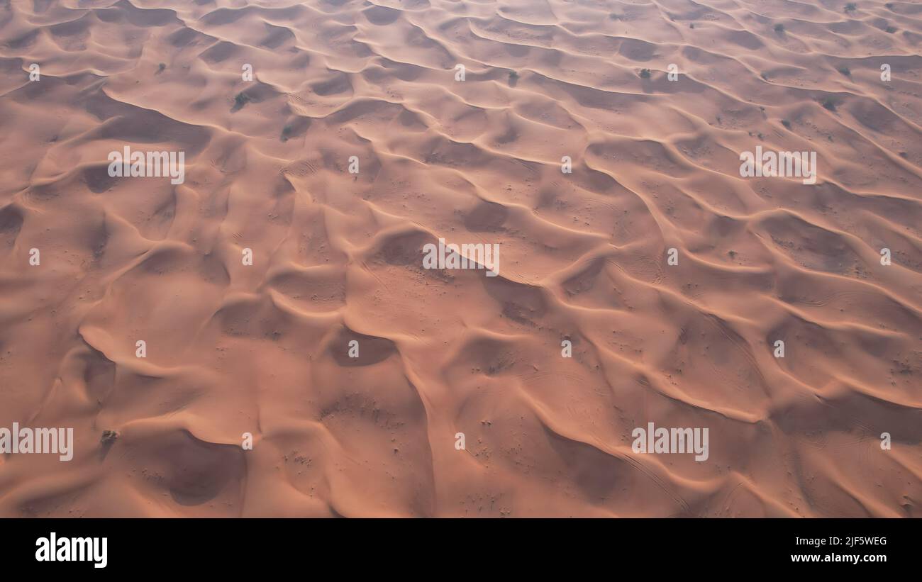 aerial view of sand dunes and a highway in a Sharjah desert, UAE ...