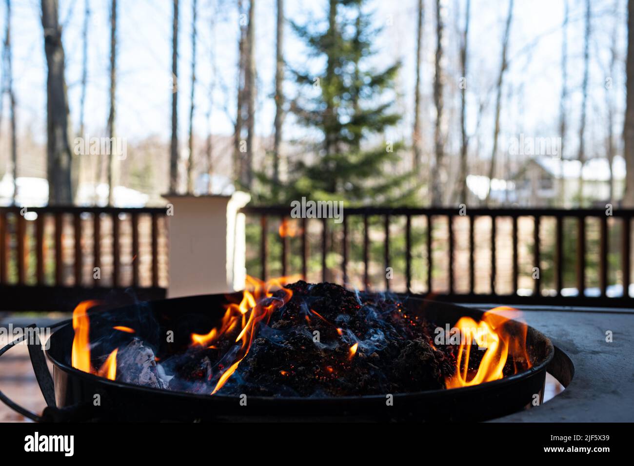 Barbecue grill with fire on open air close up Stock Photo - Alamy
