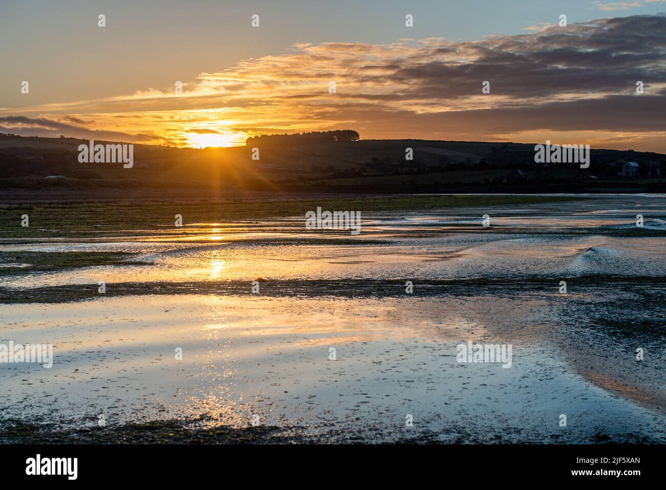Harbour View, West Cork, Ireland. 30th June, 2022. The sun rises over ...