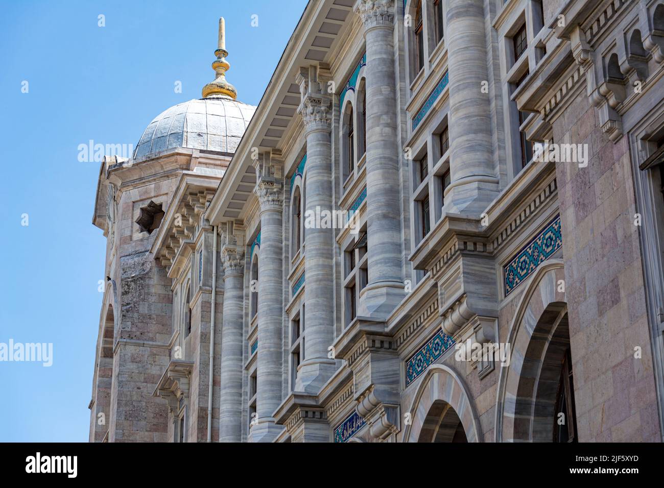 A beautiful stone building with ancient architecture in the center of ...