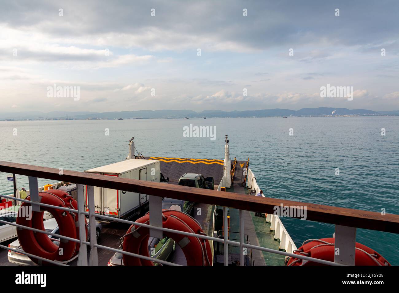 Cars are transported by ferry. The ferry transports cars across the sea ...