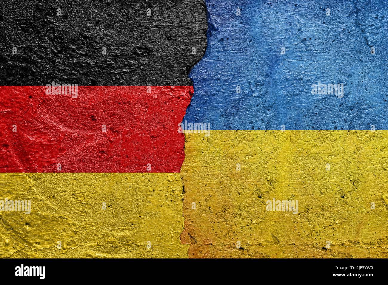 Germany and Ukraine - Cracked concrete wall painted with a Germans flag ...