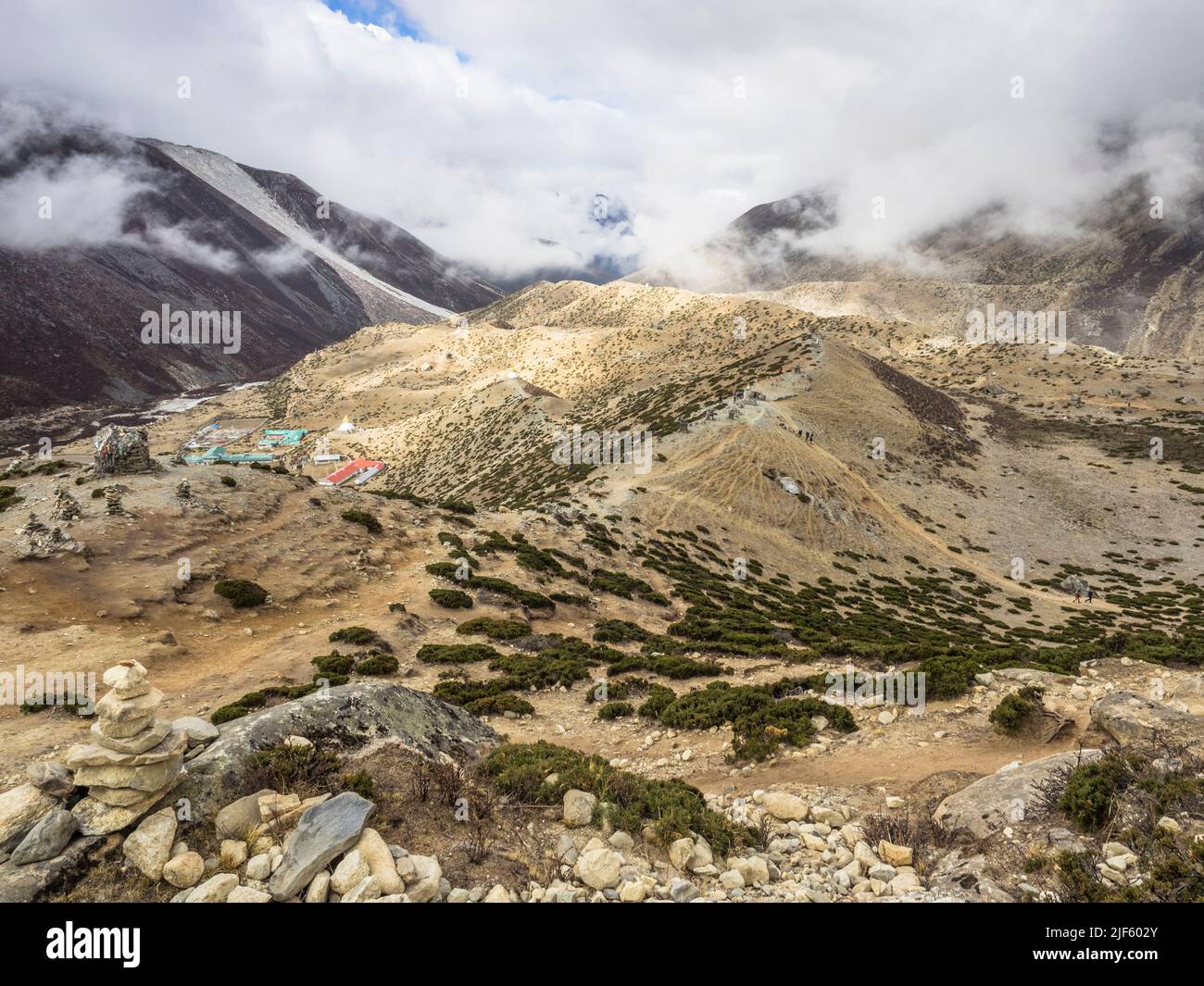 Rock cairn marking the route up the barren ridge to Nangkartshang Peak ...