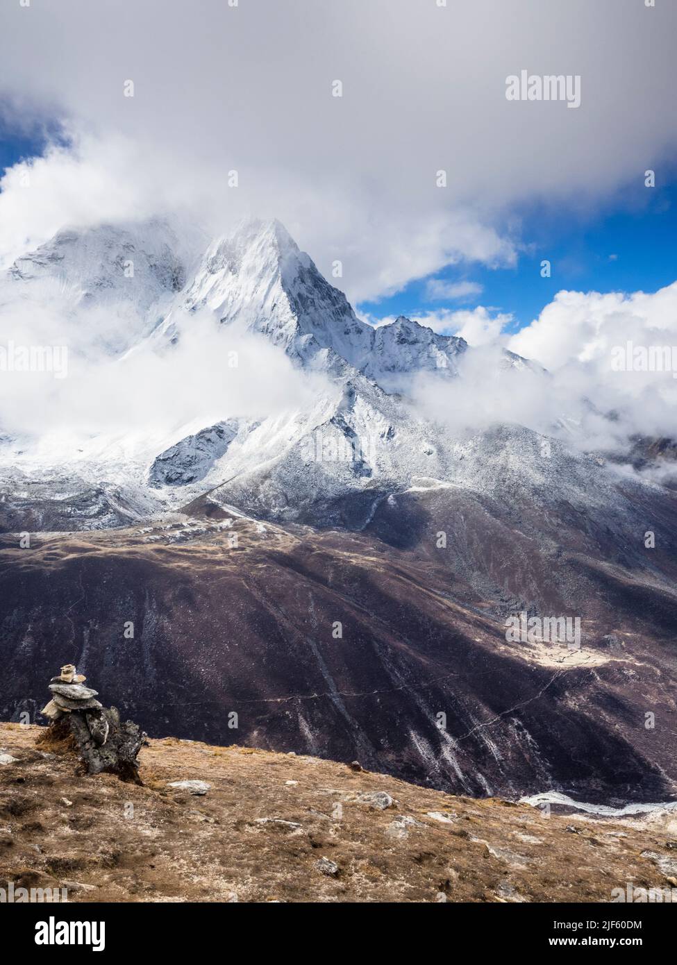 Ama Dablam shrouded in May clouds above the Imja Khola from 4860m on ...