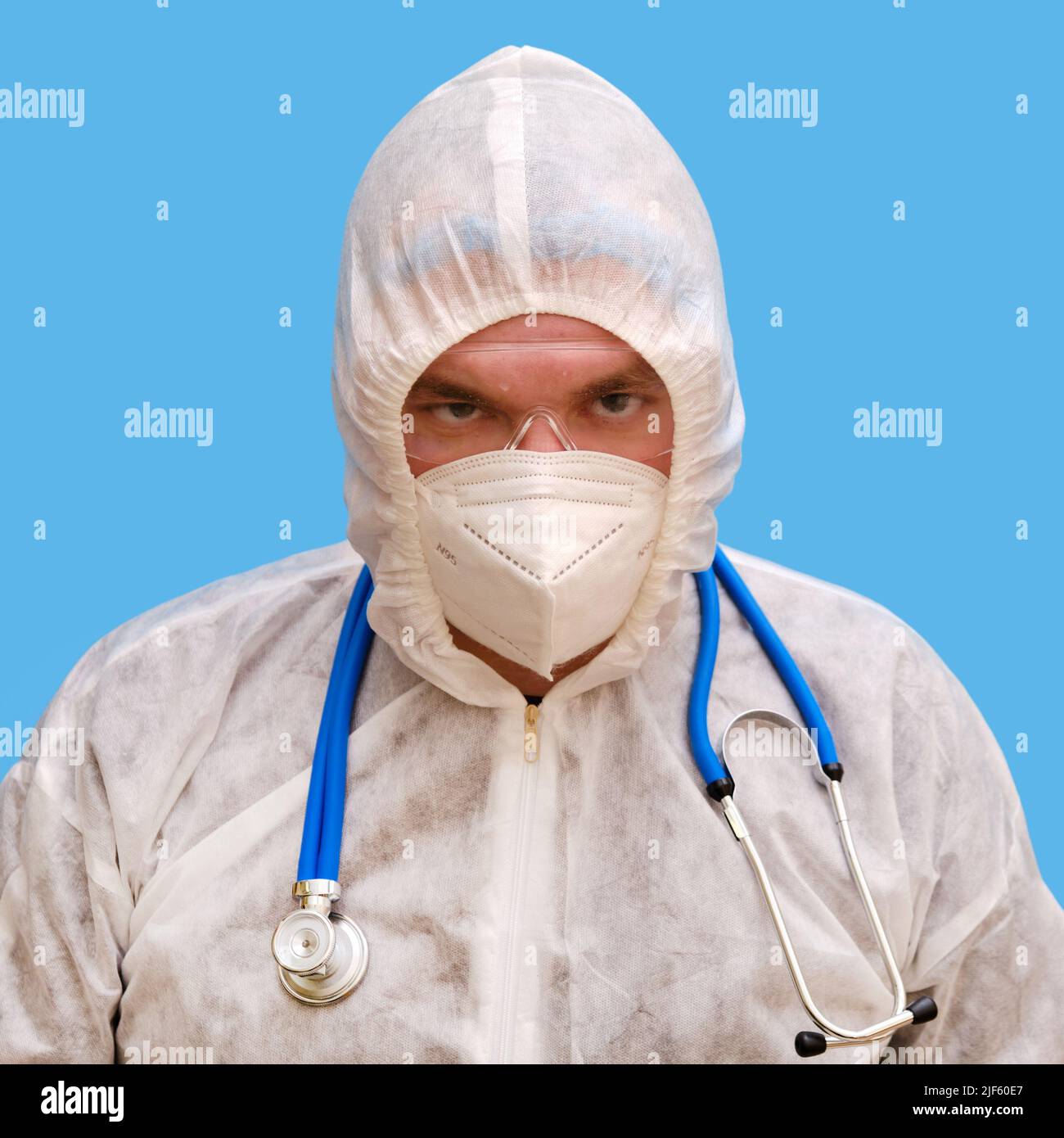 Man doctor medic in a protective suit uniform with goggles and face ...