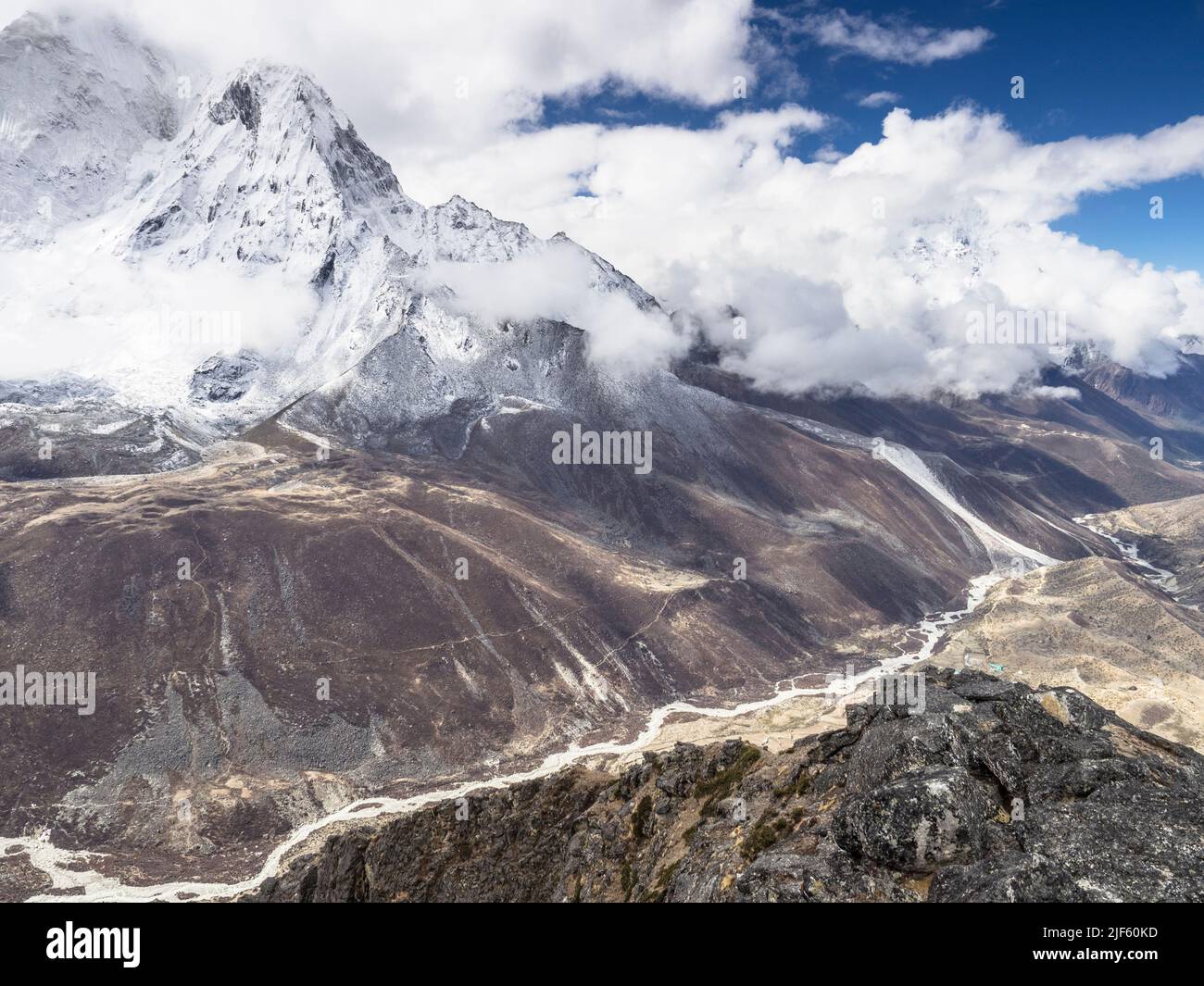 The southwest ridge and West Face of Ama Dablam hiding in May clouds ...