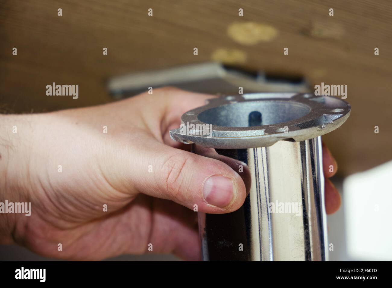 Broken leg of an office desk, repair of furniture made of wood and ...