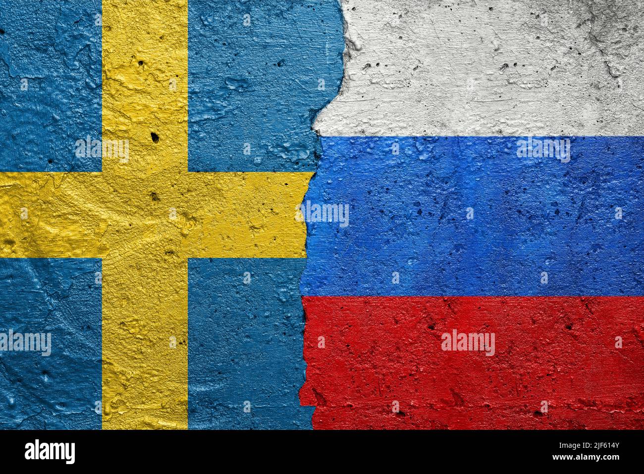 Sweden and Russia - Cracked concrete wall painted with a Swedish flag ...