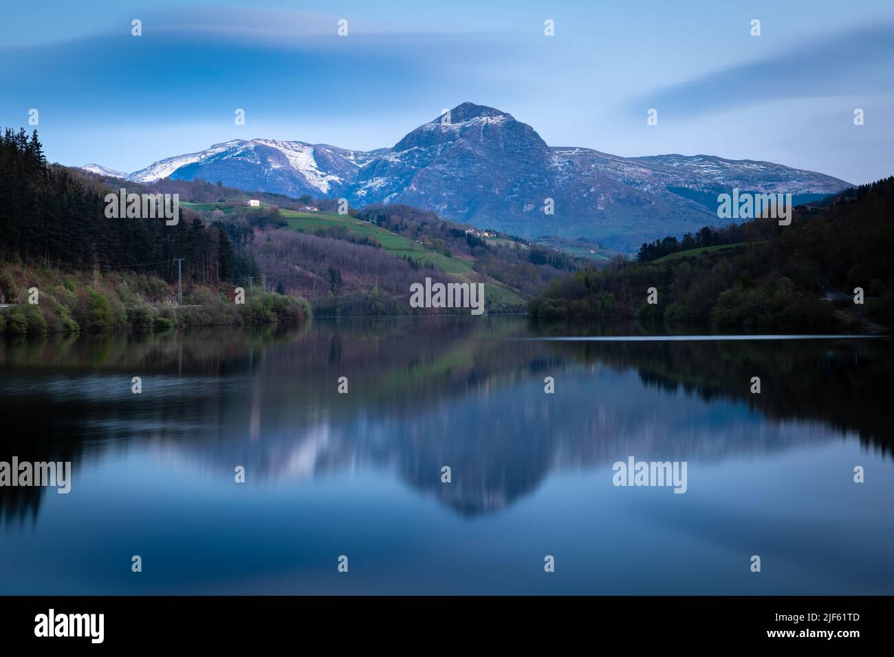 Ibiur reservoir with Txindoki mountain as background, Basque Country in ...